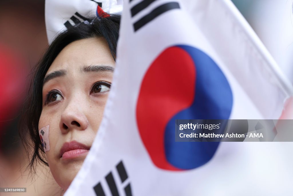 A Fan Of Korea Republic With A Flag During The Fifa World Cup Qatar