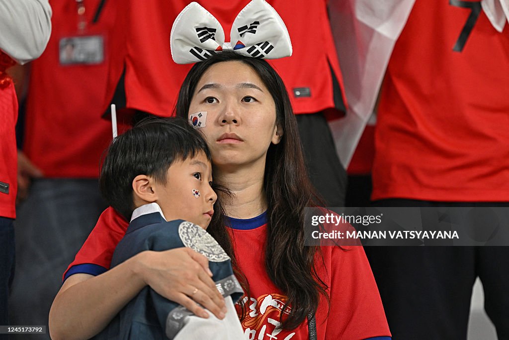 South Korea's fans react after the Qatar 2022 World Cup Group H ... South Korea's fans react after the Qatar 2022 World Cup Group H ...