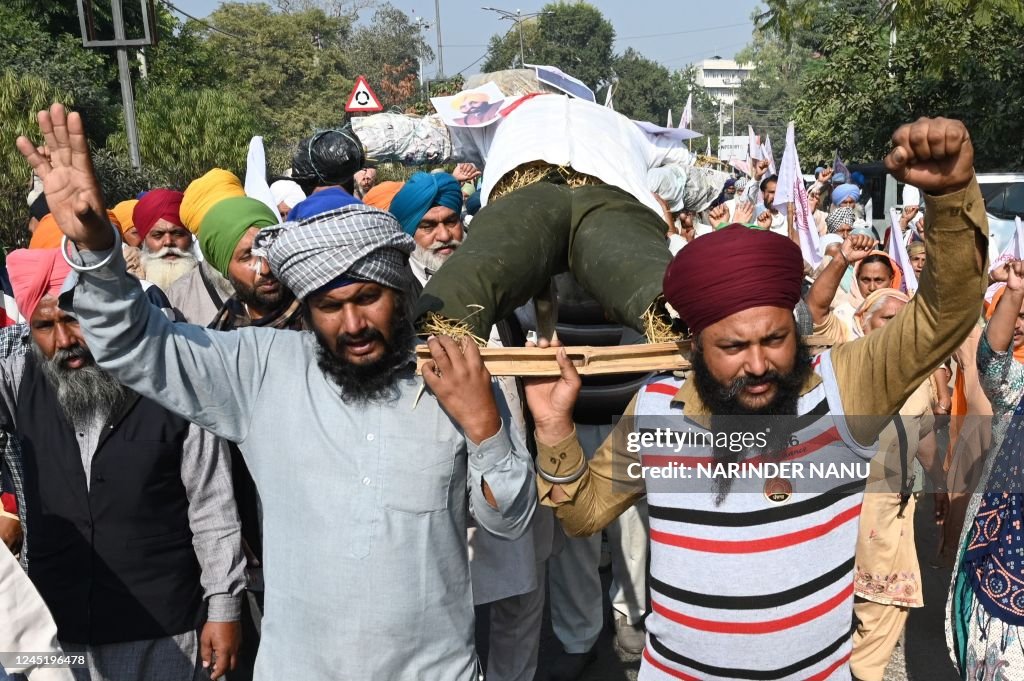 Farmers Shout Slogans As They Burn An Effigy Of Indian Prime Minister