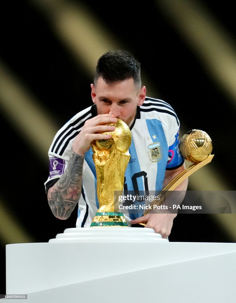 Argentinas Lionel Messi Kisses The Fifa World Cup Trophy After Being