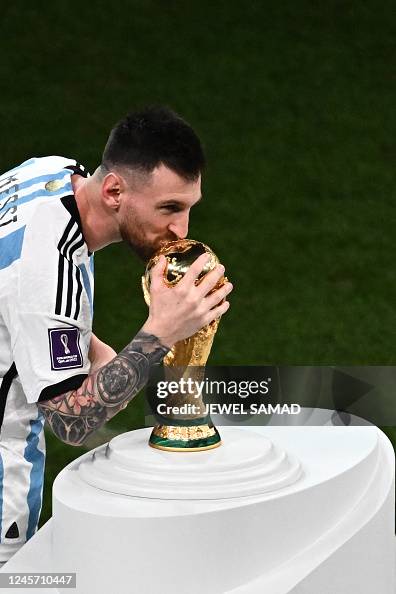 Argentinas Forward Lionel Messi Kisses The World Cup Trophy At The