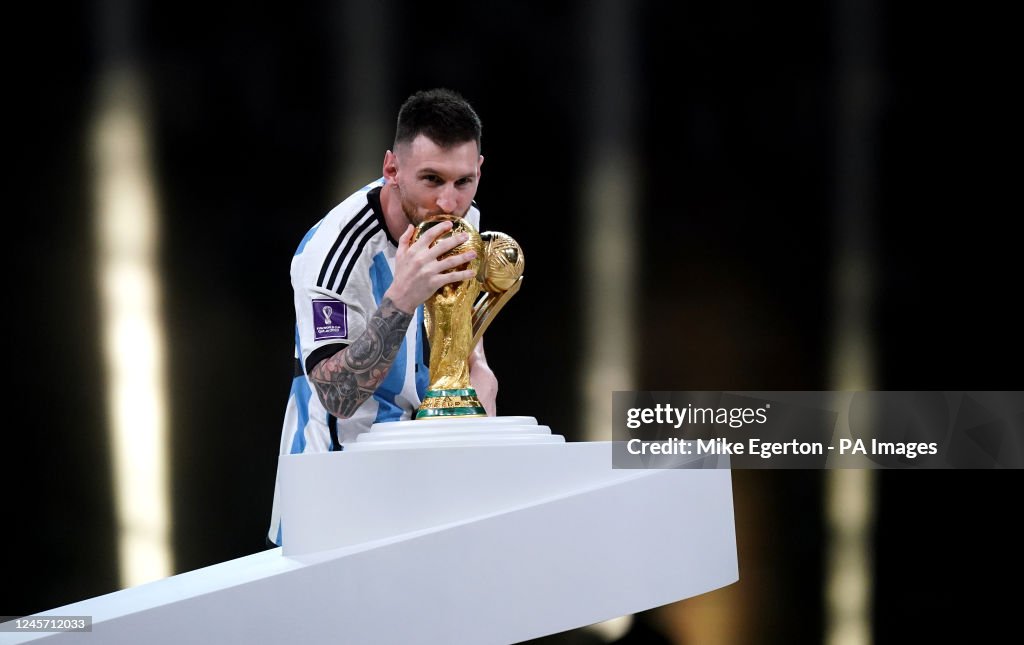 Argentinas Lionel Messi Kisses The Fifa World Cup Trophy After Being