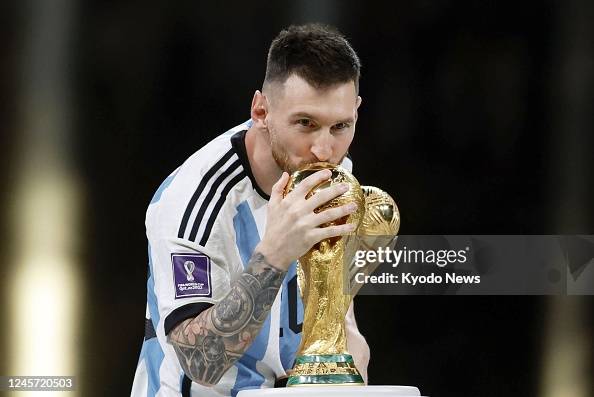 Argentinas Lionel Messi Kisses The World Cup Trophy After Receiving