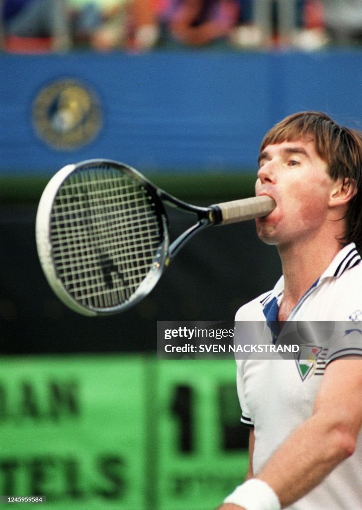 American Tennis Player Jimmy Connors Holds His Racket In His Mouth In