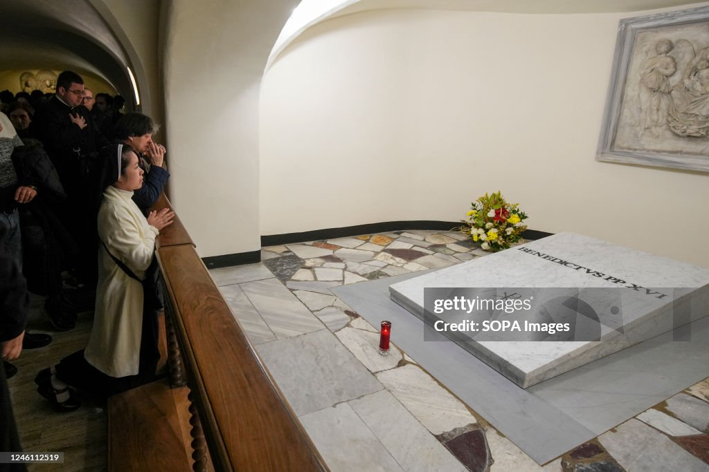 Faithful visit the tomb of late Pope Emeritus Benedict XVI inside the ... Faithful visit the tomb of late Pope Emeritus Benedict XVI inside the ...