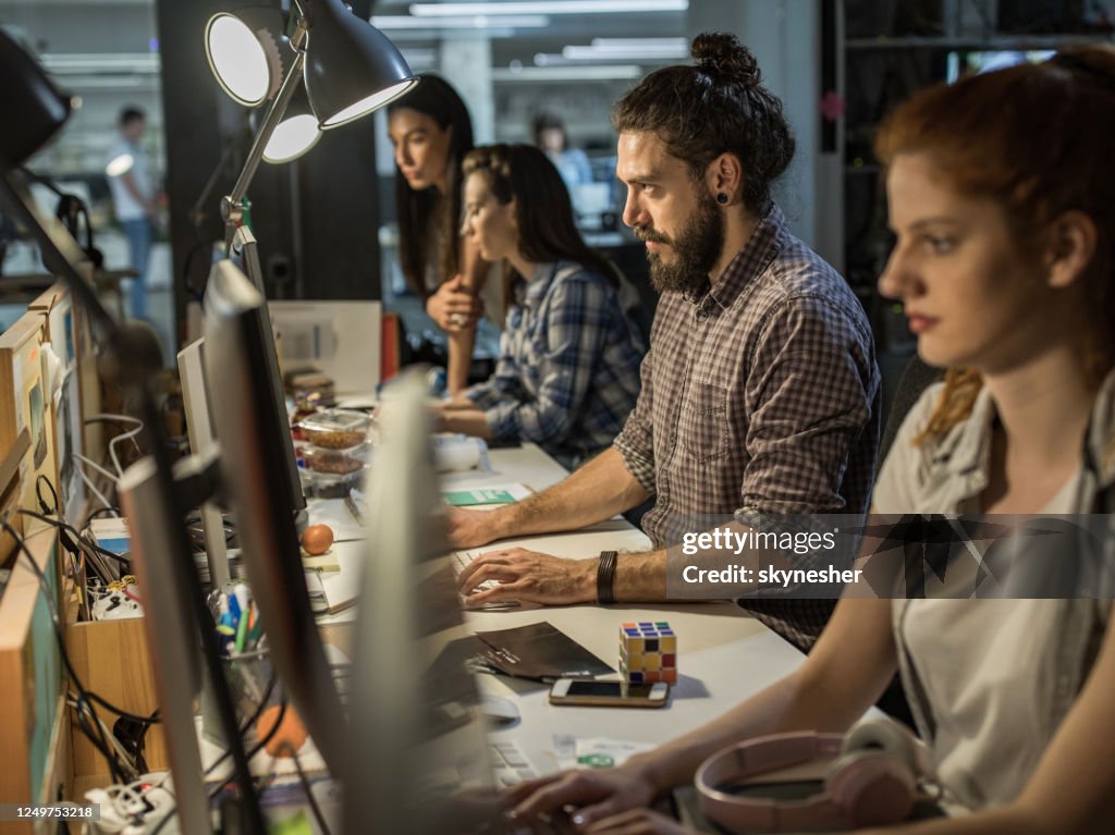Group Of Young Computer Programmers Working In The Office High-Res ... Group Of Young Computer Programmers Working In The Office High-Res ...