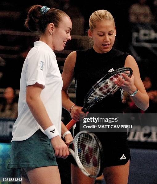 Anna Kournikova And Martina Hingis Confer During Their Match Against