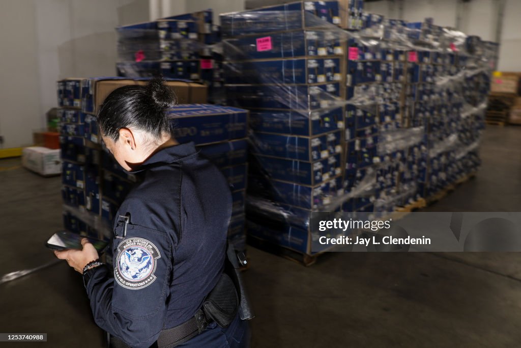 Pallets Of Imported Flowers Wait To Be Inspected By United States