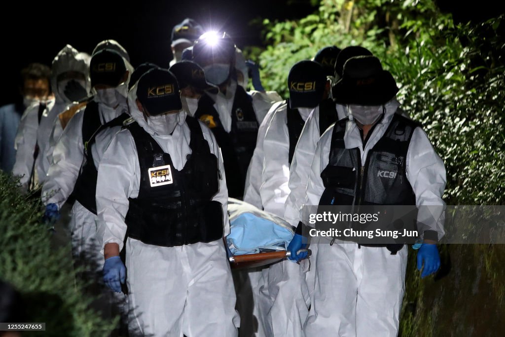Police Officers Carry The Alleged Body Of Seouls Mayor Park Won Soon