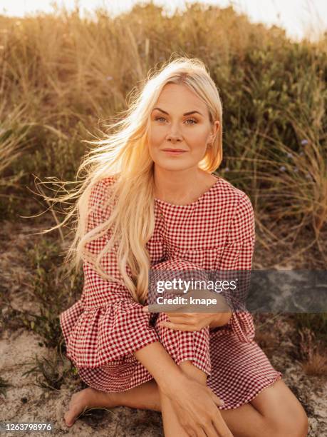 Beautiful Woman In Nature With The Wind Blowing Her Hair Fotografías E