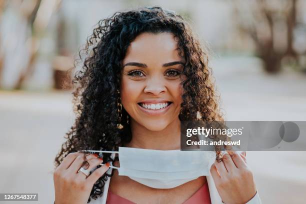 Removing Mask From Face Imagens E Fotografias De Stock Getty Images