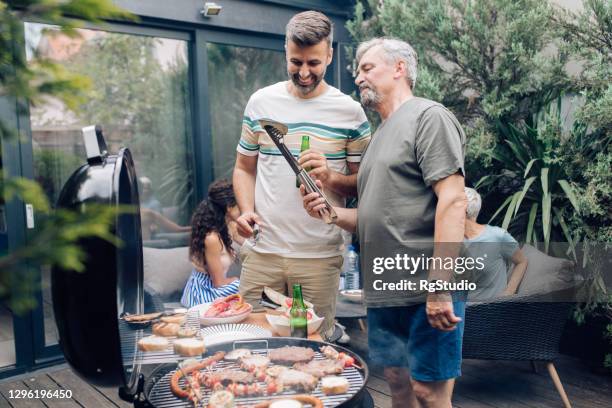 Father Son Smoking Photos And Premium High Res Pictures Getty Images