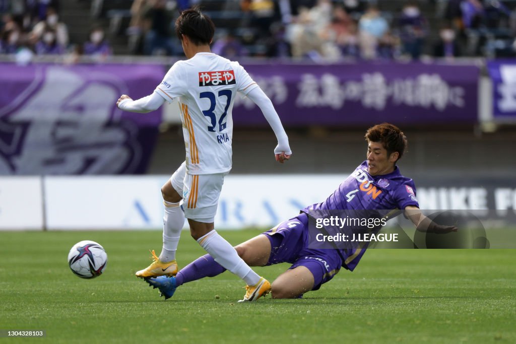 Hayato ARAKI of Sanfrecce Hiroshima makes a sliding tackle during the ... Hayato ARAKI of Sanfrecce Hiroshima makes a sliding tackle during the ...