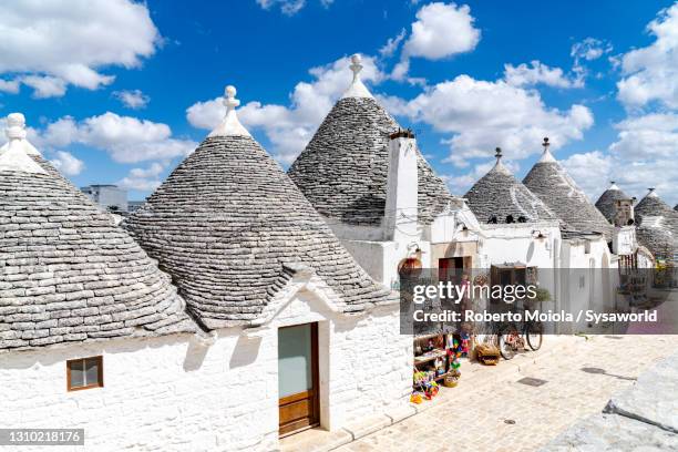 White Trulli huts in summer, Alberobello, Puglia, Roberto Moiola ...