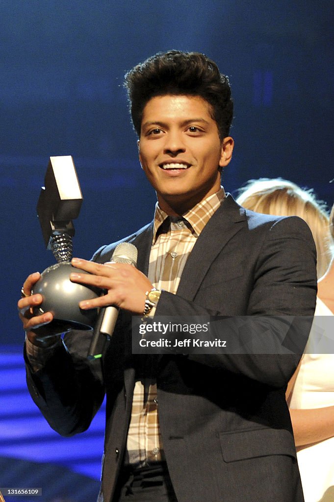 Singer Bruno Mars Receives The Award For Best New Act Onstage During