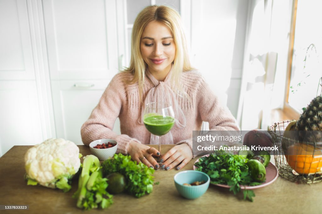 Young Beautiful Woman Drinking Green Juice For Detoxing Diet High Res
