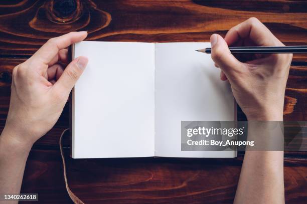 Open Book Writing Photos and Premium High Res Pictures - Getty Images Open Book Writing Photos and Premium High Res Pictures - Getty Images