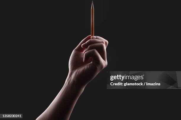 Arm Holding Pencil Photos and Premium High Res Pictures - Getty Images Arm Holding Pencil Photos and Premium High Res Pictures - Getty Images