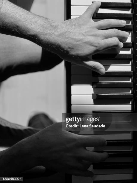 Black Piano Hands Photos And Premium High Res Pictures Getty Images