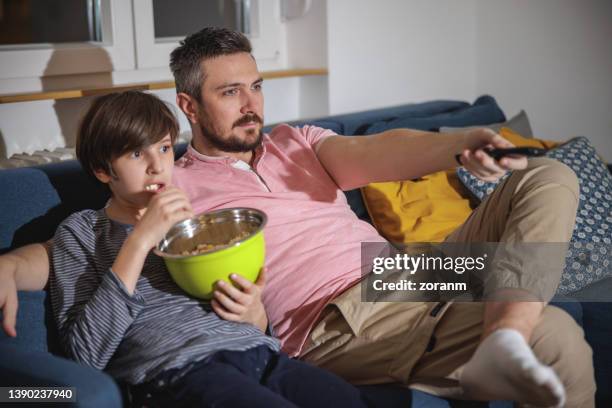 Father Son Watching Tv Night Photos And Premium High Res Pictures