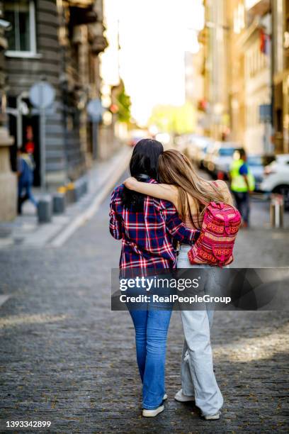 Two Girls Touching Each Other Photos And Premium High Res Pictures