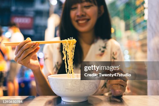 Young Asian Woman Enjoys Eating Chinese Noodle Street Food At Yaowarat Bangkok Chinatown In