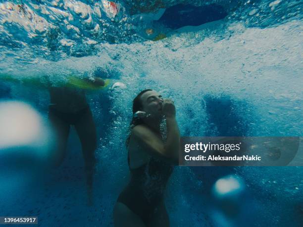 One Piece Swimsuit Underwater Photos And Premium High Res Pictures