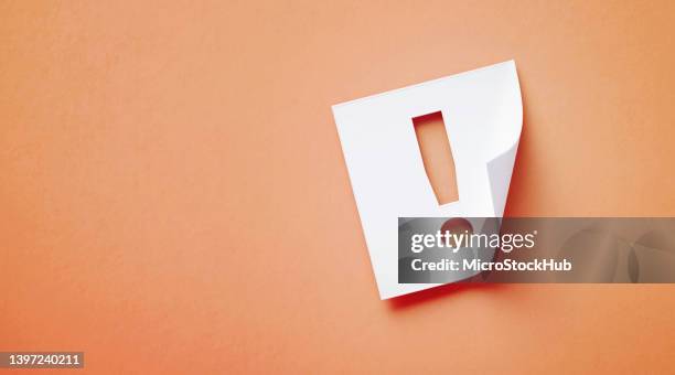 White Adhesive Note With Cutout Exclamation Point Sitting Over Orange ...