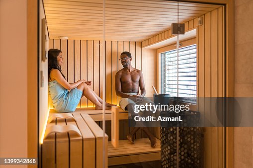 Good Looking Couple Of Husband And Wife Relaxing In The Sauna And