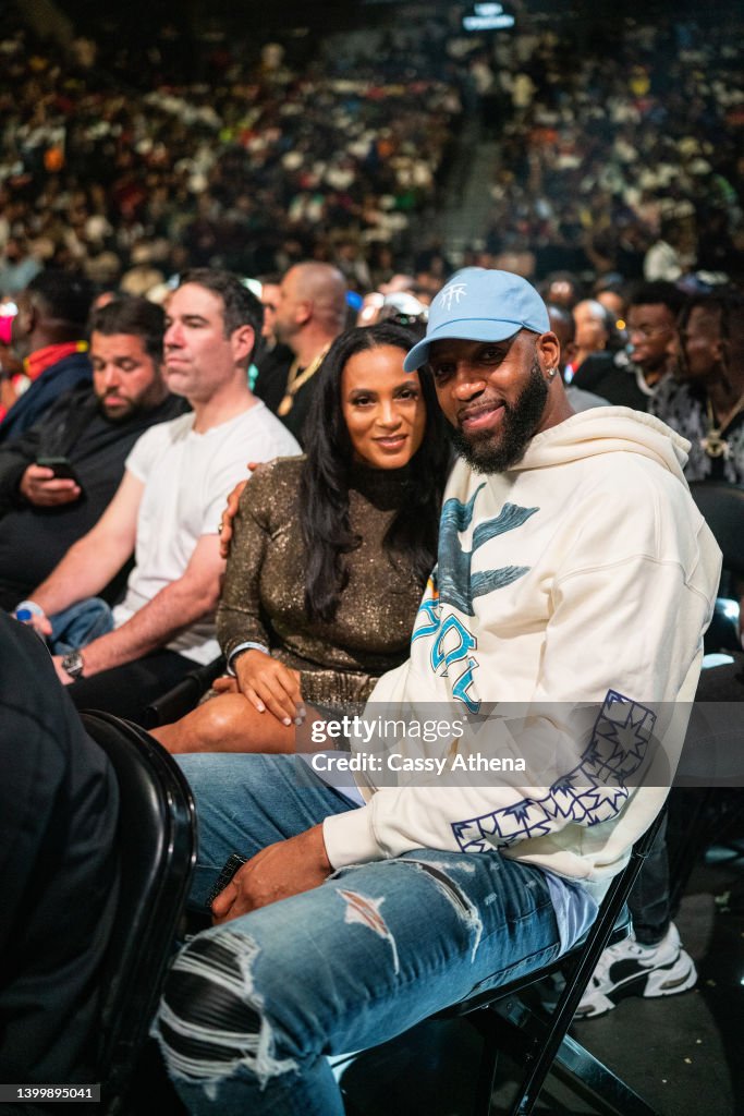 Host and Former NBA Player Tracy McGrady poses with his wife at the ... Host and Former NBA Player Tracy McGrady poses with his wife at the ...