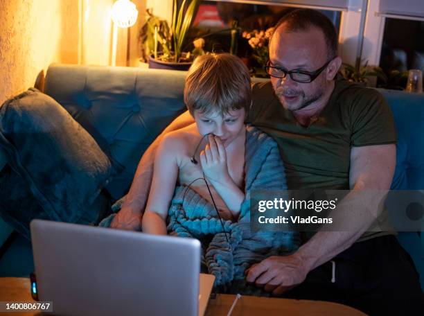 Father Son Watching Tv Night Photos And Premium High Res Pictures