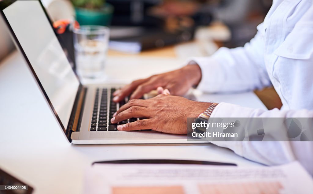 Closeup Of An Unknown Professional Man Typing On A Laptop In A Modern ... Closeup Of An Unknown Professional Man Typing On A Laptop In A Modern ...