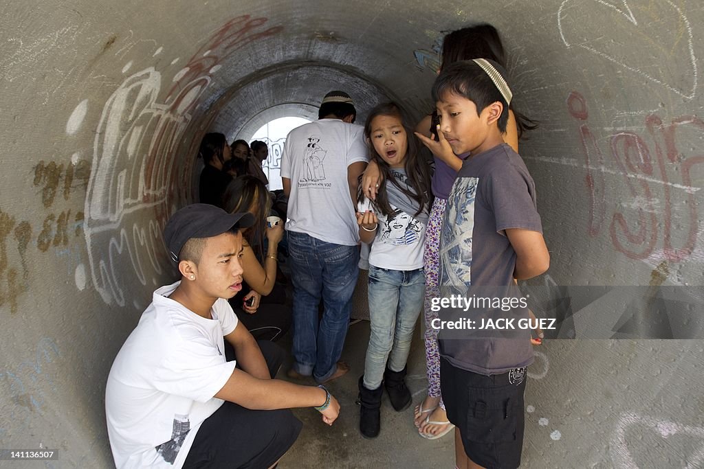 Israelis take cover in a concrete shelter in Nitzan, south of the ... Israelis take cover in a concrete shelter in Nitzan, south of the ...