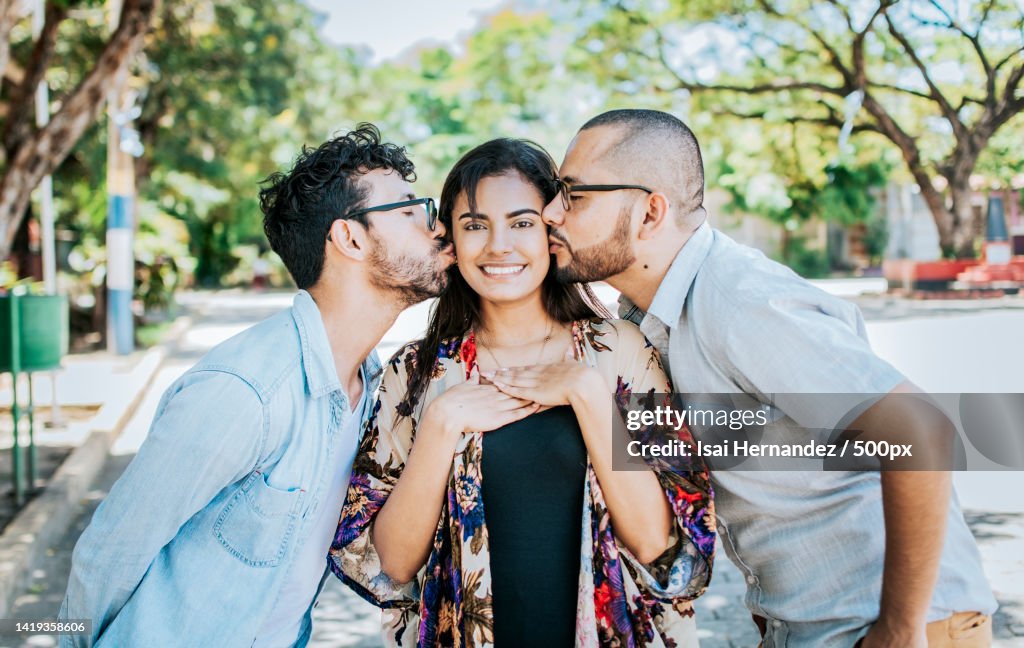 Two Men Kissing A Girl Cheek Portrait Of Two Guys Kissing A Girl Cheek