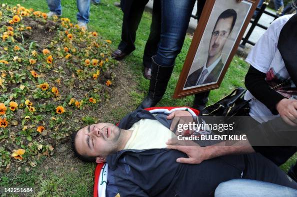 Supporters of Syrian president Bashar Al-Assad react after anti riot ... Supporters of Syrian president Bashar Al-Assad react after anti riot ...