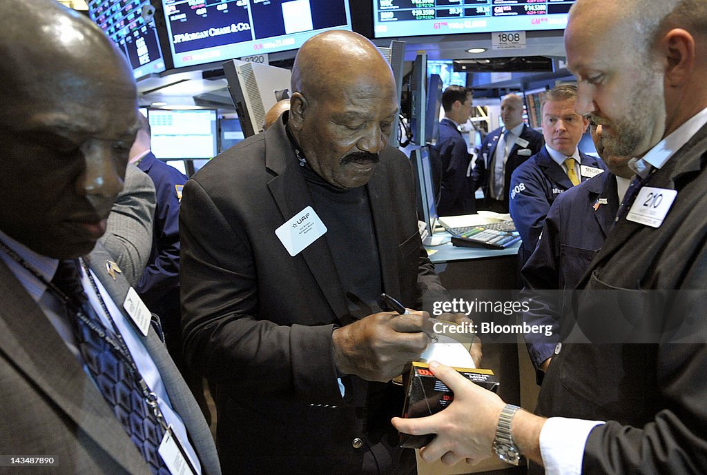 Former professional football player Jim Brown, center, signs... News ... Former professional football player Jim Brown, center, signs... News ...