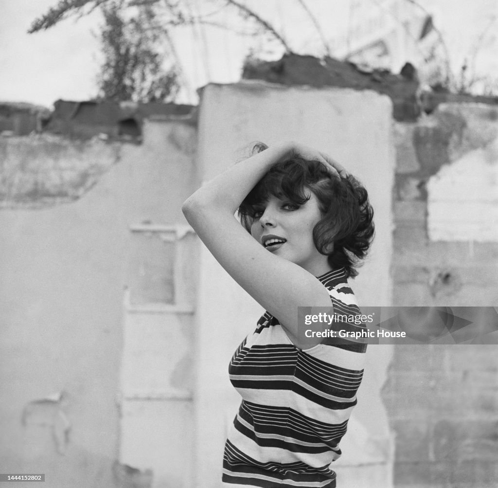 British Actress Joan Collins Wearing A Hooped Sleeveless Top Poses News Photo Getty Images