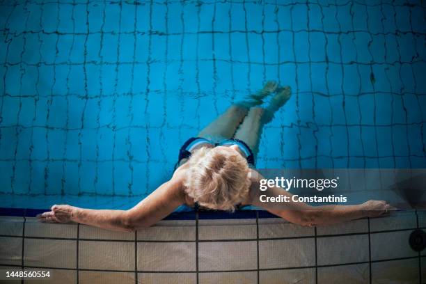Mature Woman Pool Float Photos And Premium High Res Pictures Getty Images
