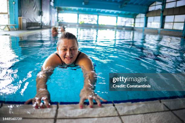 Mature Woman Pool Float Photos And Premium High Res Pictures Getty Images
