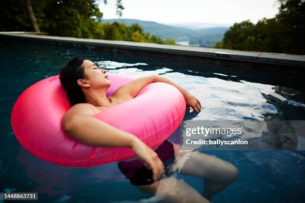 Mature Woman Pool Float Photos And Premium High Res Pictures Getty Images