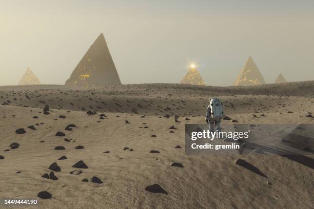 Astronaut Walking Towards Mysterious Pyramids High-Res Stock Photo ... Astronaut Walking Towards Mysterious Pyramids High-Res Stock Photo ...