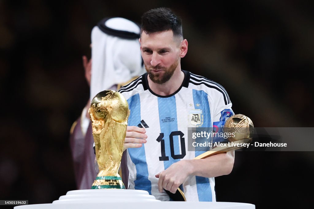 Lionel Messi Of Argentina Kisses The World Cup Trophy After The Fifa