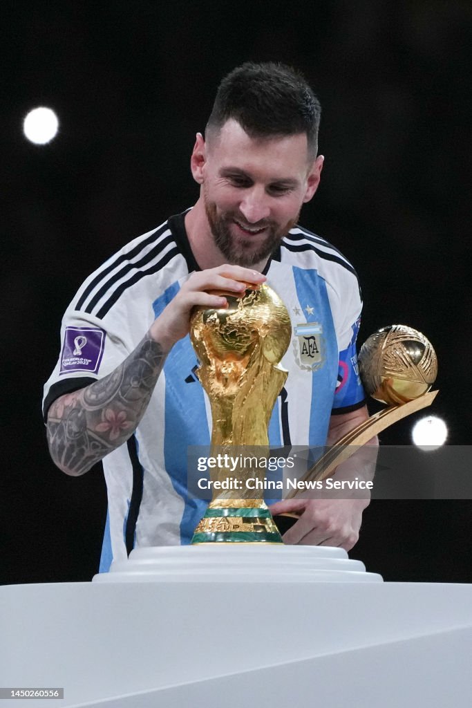 Lionel Messi Of Argentina With The FIFA World Cup Golden Ball Trophy lionel-messi-of-argentina-with-the-fifa-world-cup-golden-ball-trophy