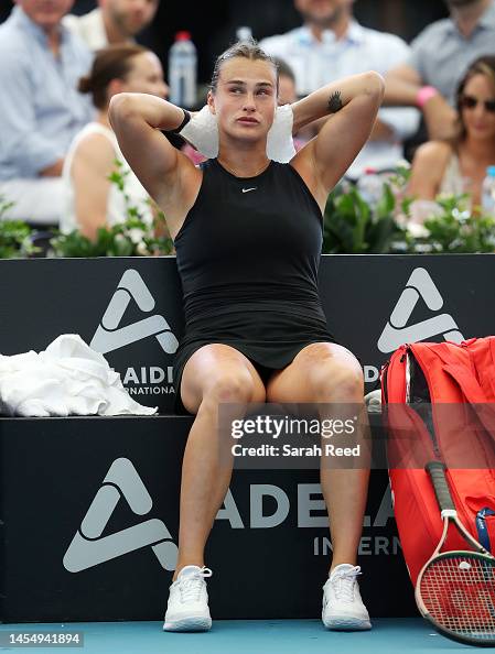 Aryna Sabalenka puts ice on her face during a break as she competes ... Aryna Sabalenka puts ice on her face during a break as she competes ...