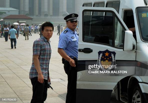 Police Detain A Man In Tiananmen Square On The 23rd Anniversary Of