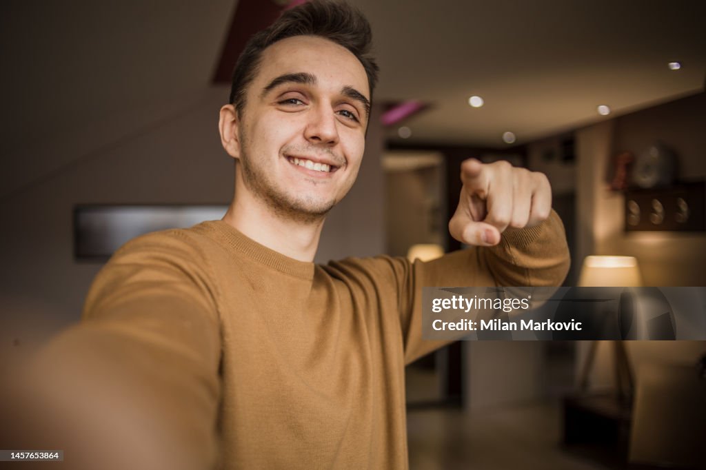 Handsome Caucasian Man Taking Self Portrait Indoors At Home In His
