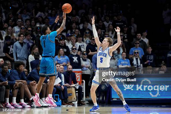 Primo Spears of the Georgetown Hoyas attempts a shot while being ... Primo Spears of the Georgetown Hoyas attempts a shot while being ...