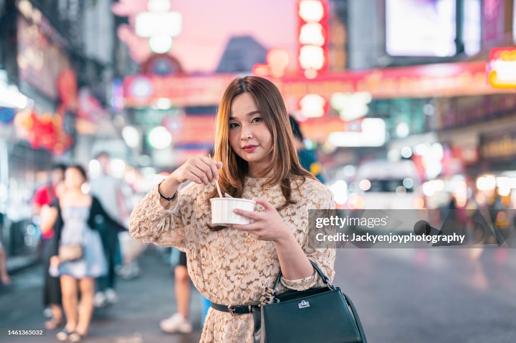 Young Asian Woman Enjoy Street Food On Yaowarat Road Or China Town In Bangkok Photo Getty Images