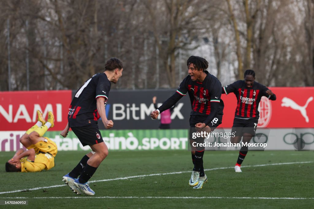 Kevin Zeroli Of Ac Milan Celebrates With Team Mates After Scoring To