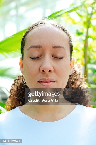 Portrait Of Young Cheerful African American Woman Mindfulness In Green